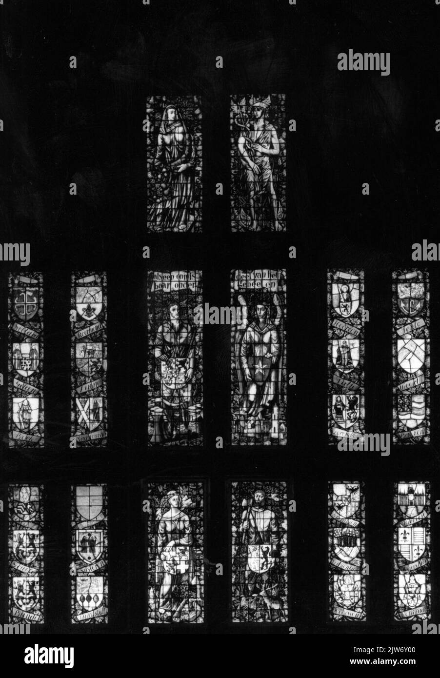 Image of the stained glass window with various city weapons and ...