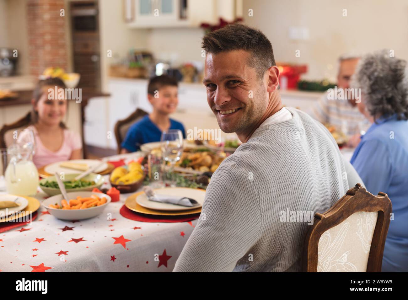 Caucasian man sitting table hi-res stock photography and images - Alamy