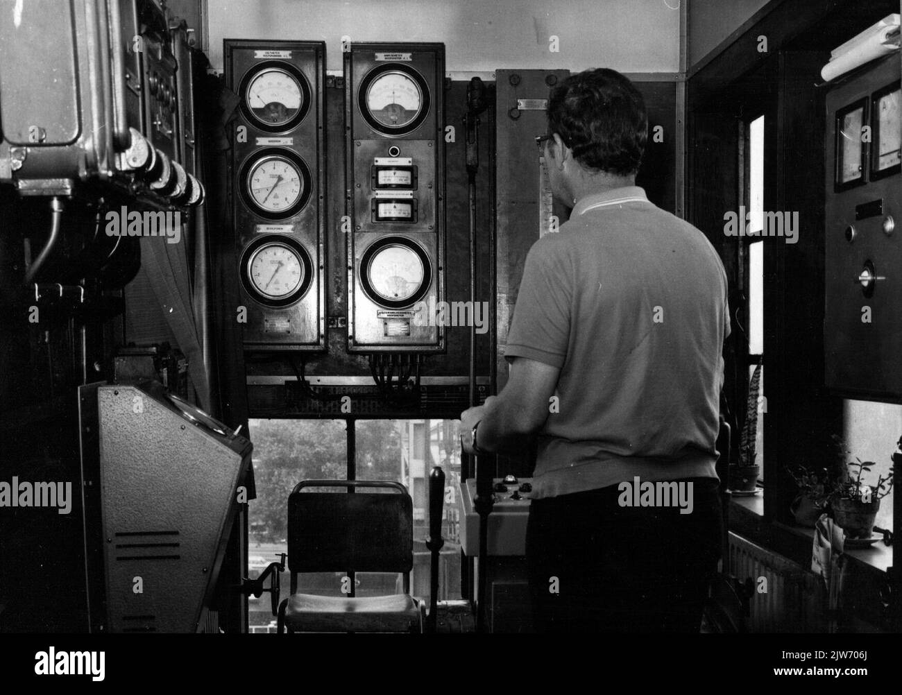 Image of a bridge keeper in the control room of the Spoorweghefbrug ...