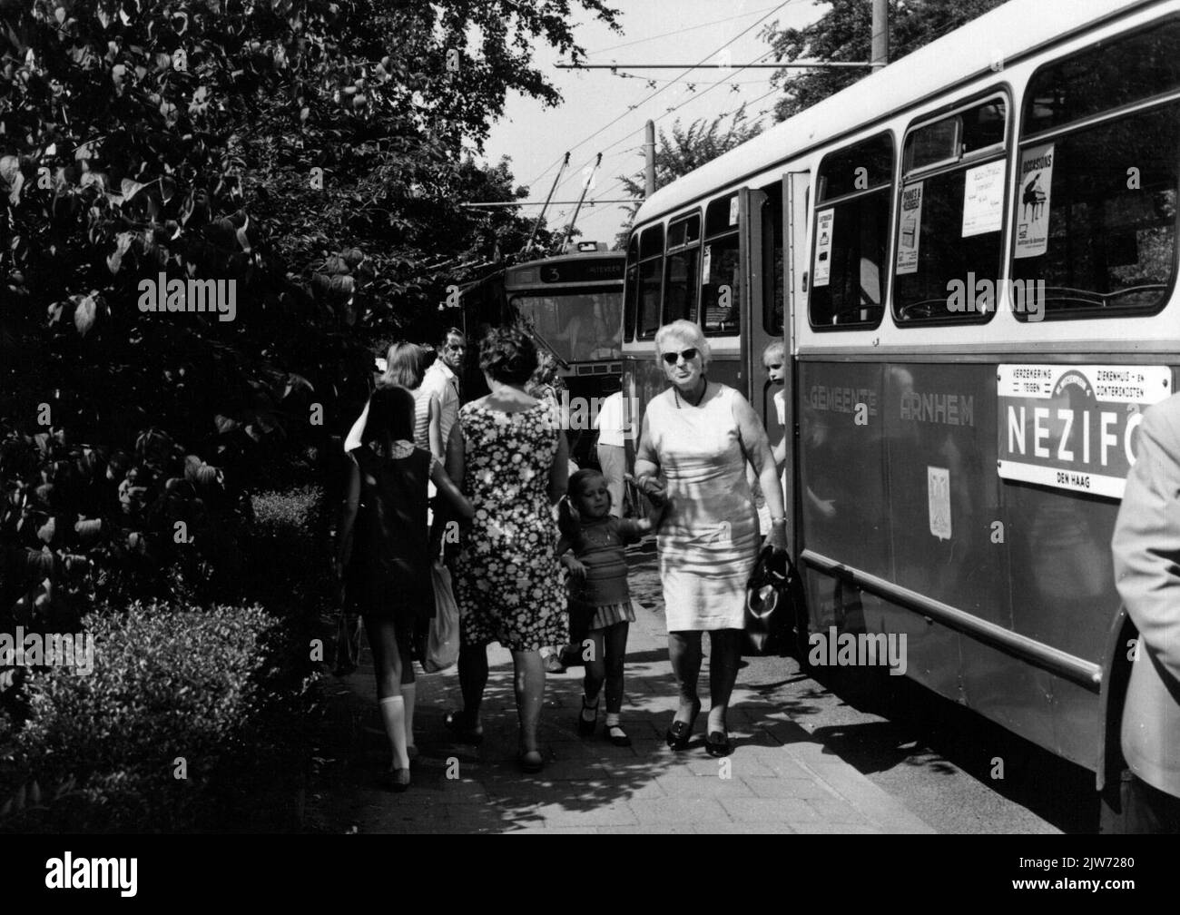 Image of day trippers at the trolley bus stop Alteveer in Arnhem Stock ...