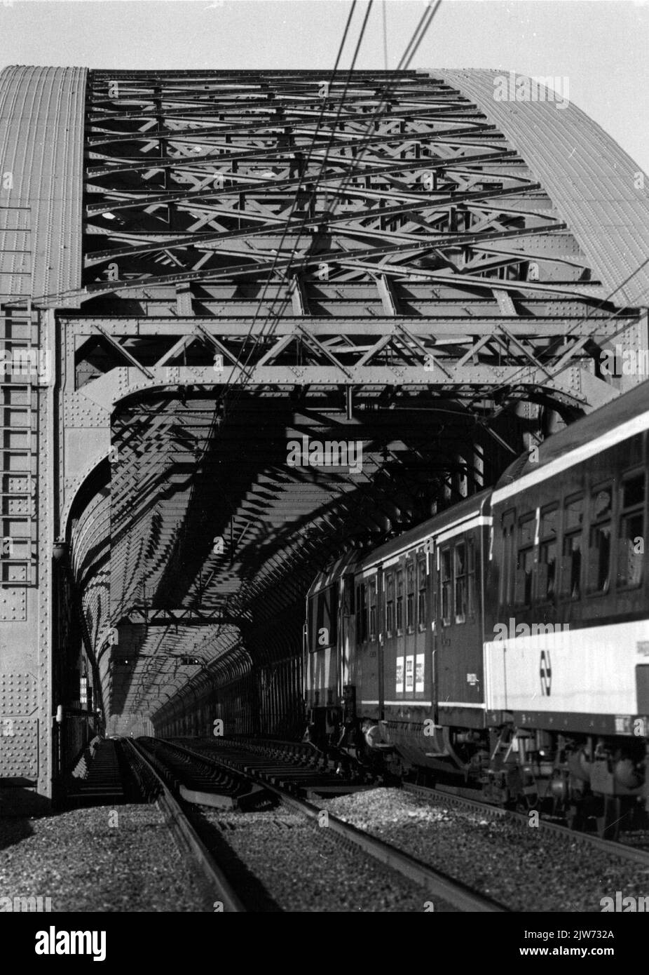 View of the railway bridge over the Lek at Culemborg with a train ...