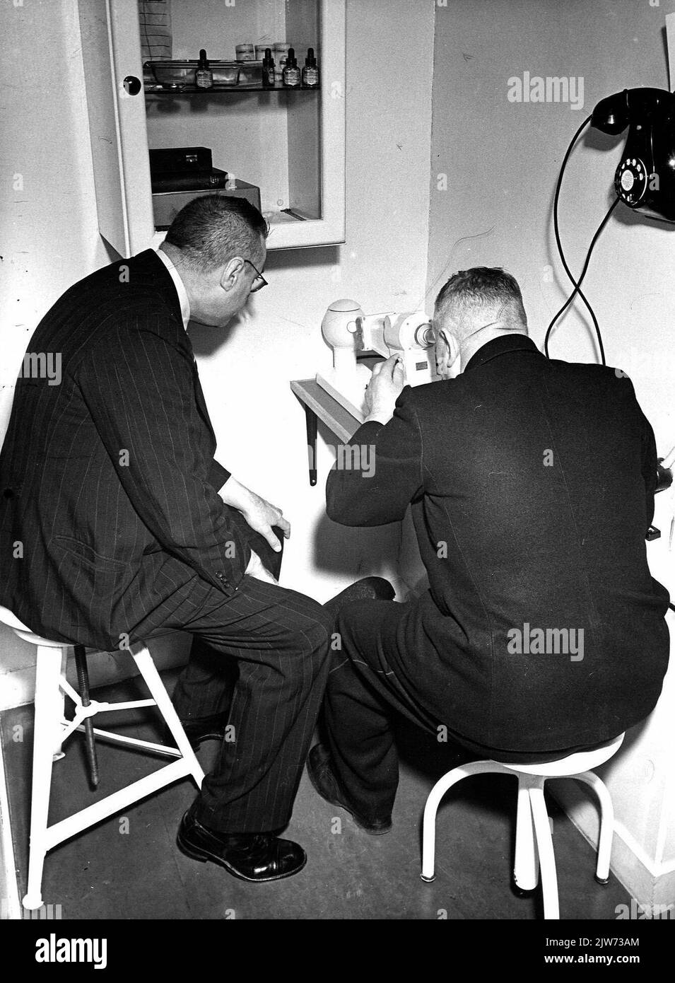 Image of conducting eye examination during an inspection by the medical ...