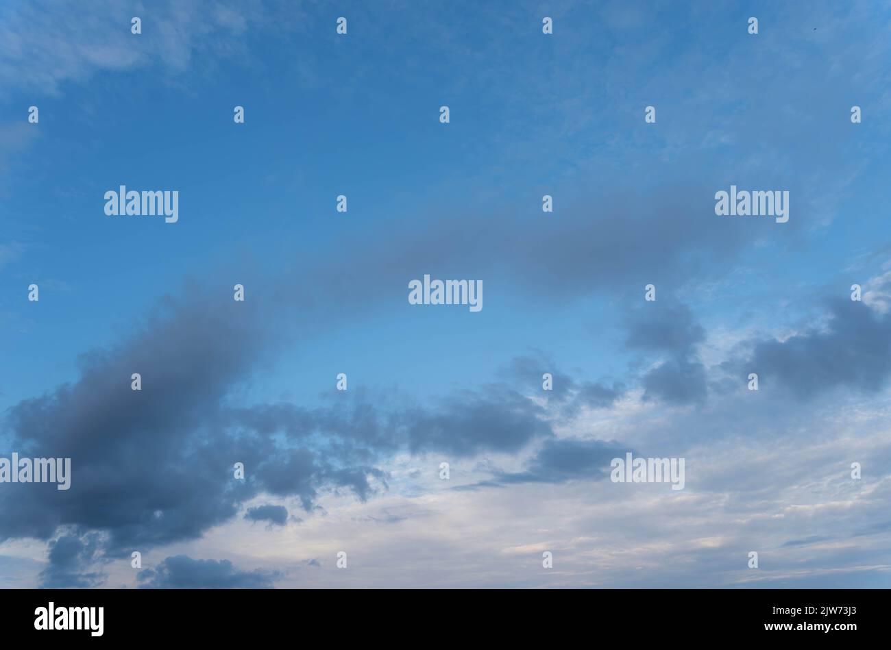 Dramatic blue sky with puffy white and grey clouds on summer day Stock ...