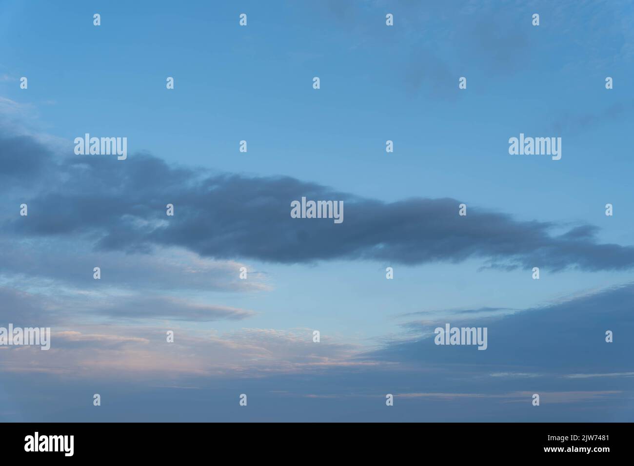 Blue sky with clouds, blue hour Stock Photo - Alamy
