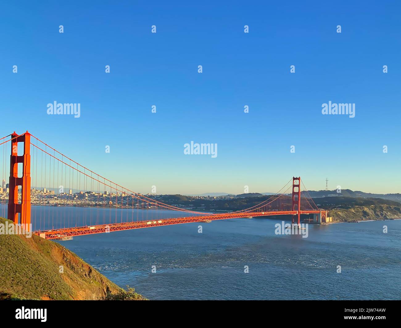 A shot of a Golden Gate bridge with a San Francisco cityscape in the ...