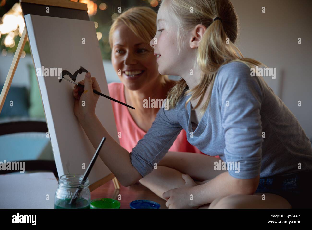 Mother and daughter painting together Stock Photo - Alamy