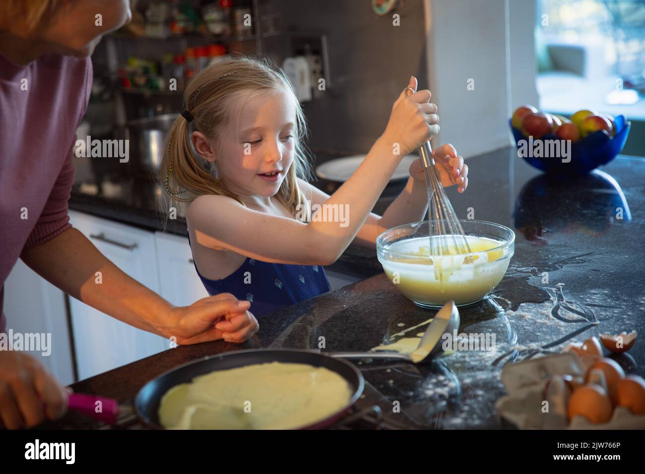 Mother and daughter cooking together Stock Photo - Alamy