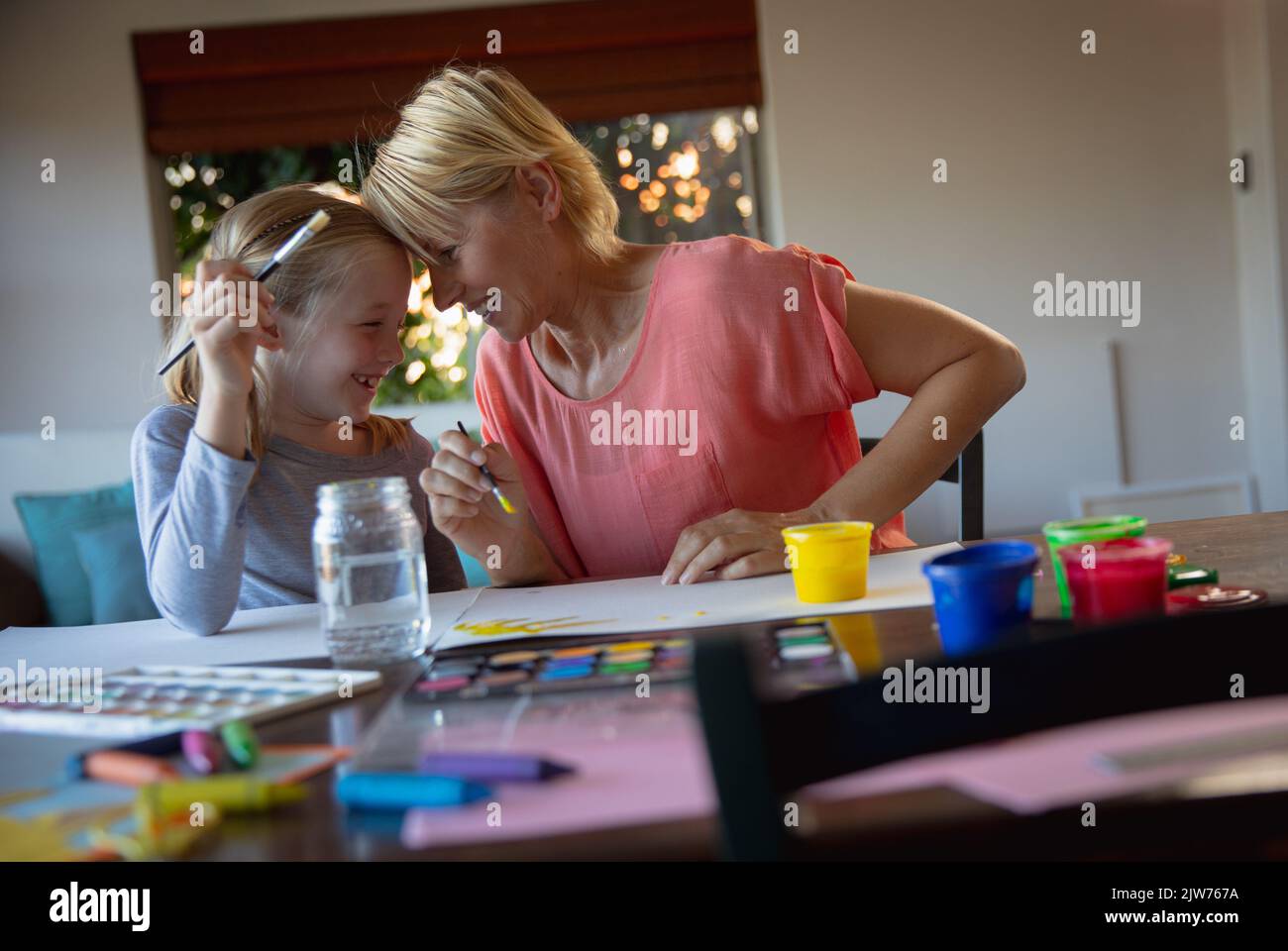 Mother and daughter painting together Stock Photo - Alamy