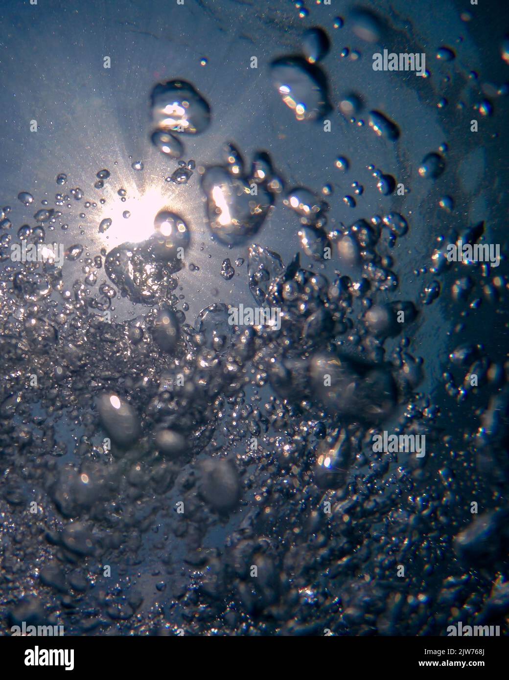 Under water bubble. Playing in the surf to capture bubbles rising to ...