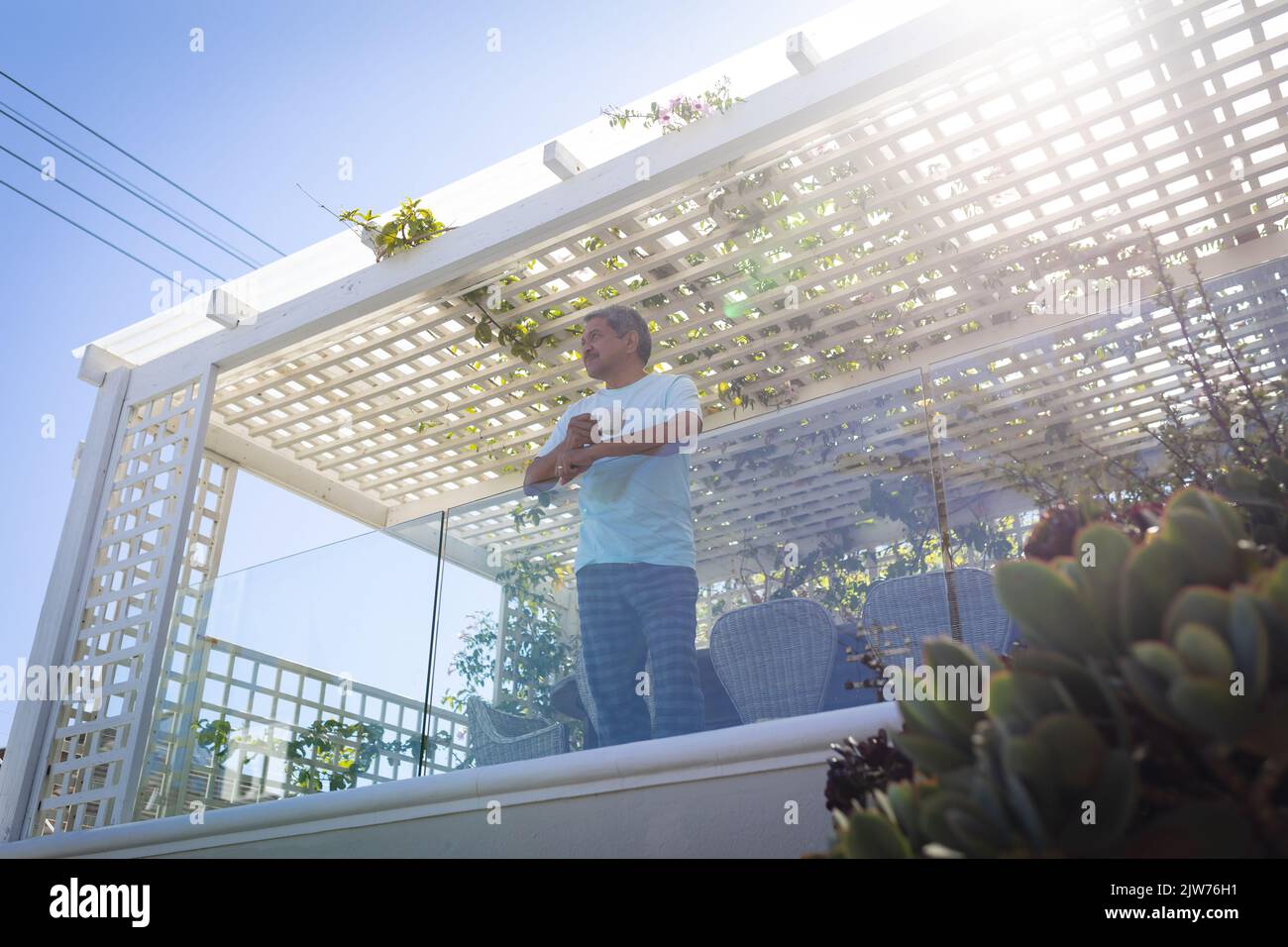 Senior african american man standing on a terrace Stock Photo - Alamy