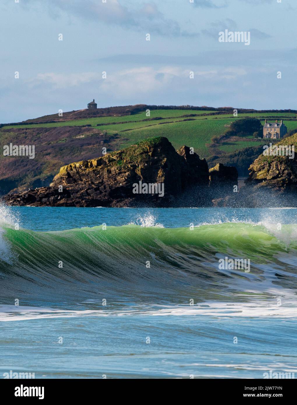 Moody waves crashing into shore at Praa sands beach Cornwall Stock ...