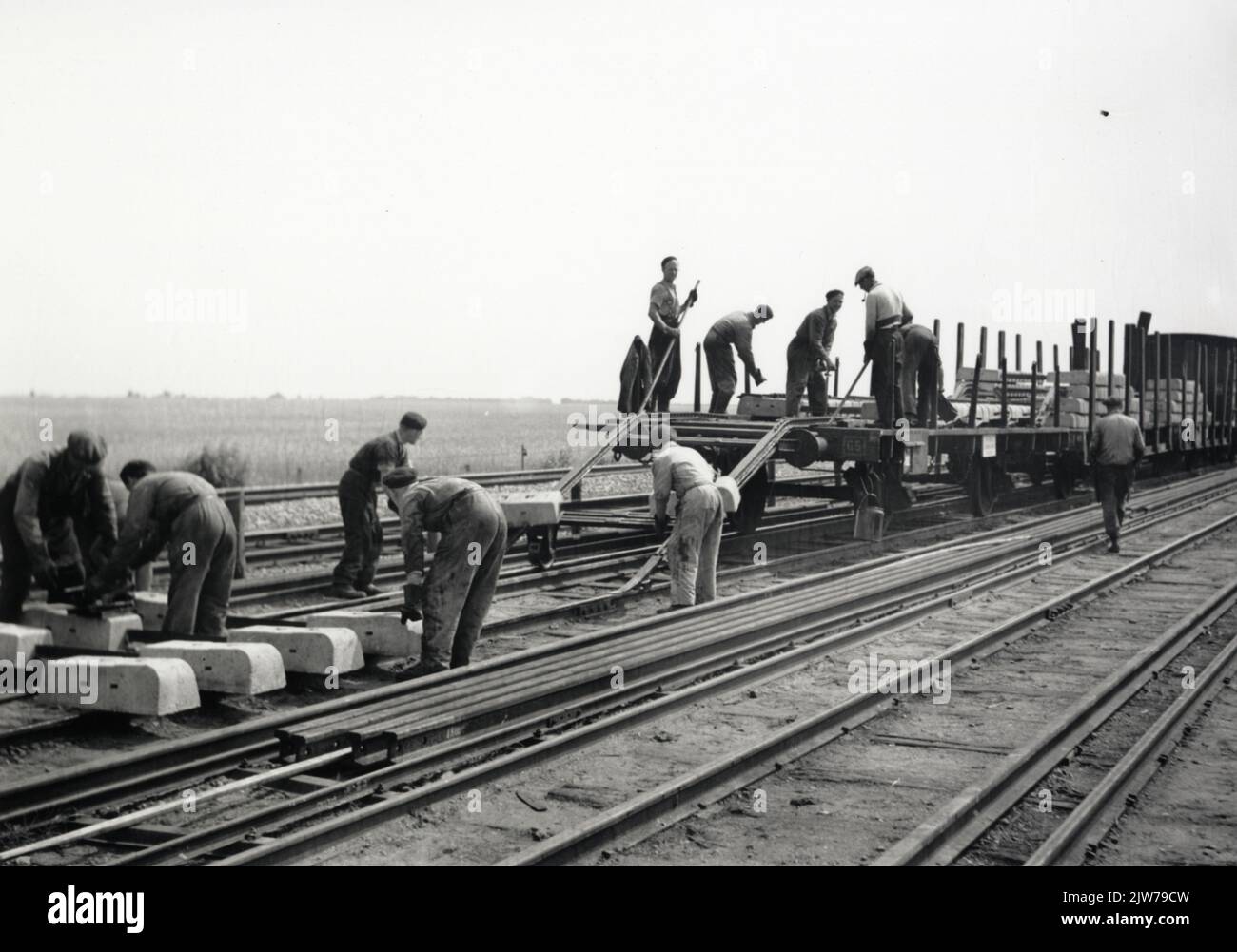 Image of unloading concrete sleepers by road workers of the N.S. on the ...