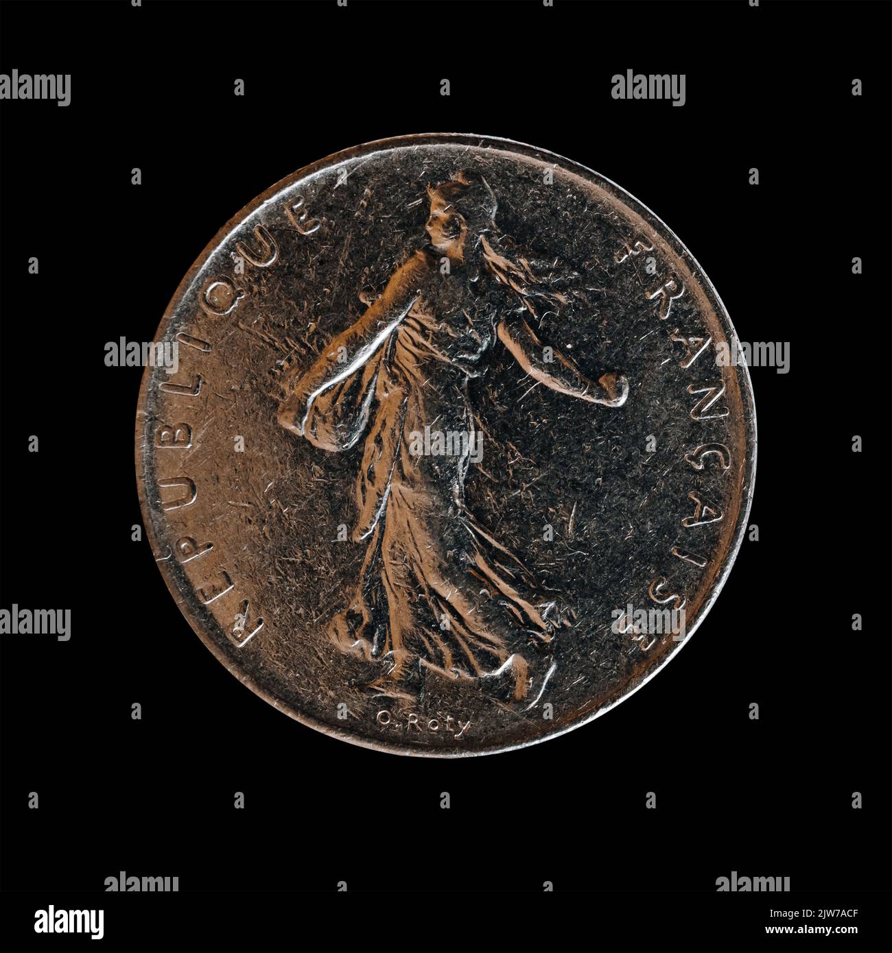 A closeup of a 5 francs coin from 1991 isolated on a black background ...