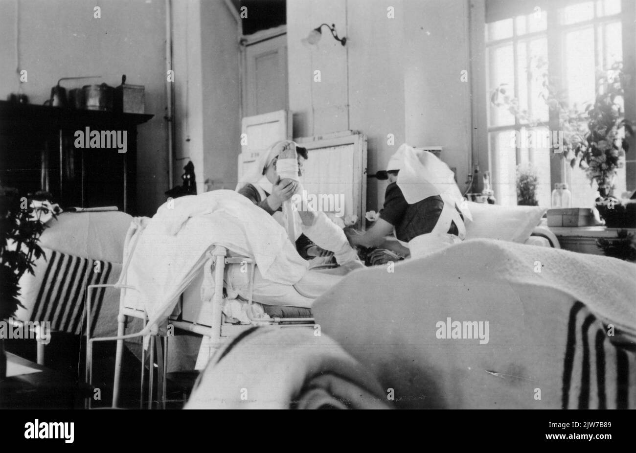 Image of two nurses who nurses a military nursing to his injuries he ...