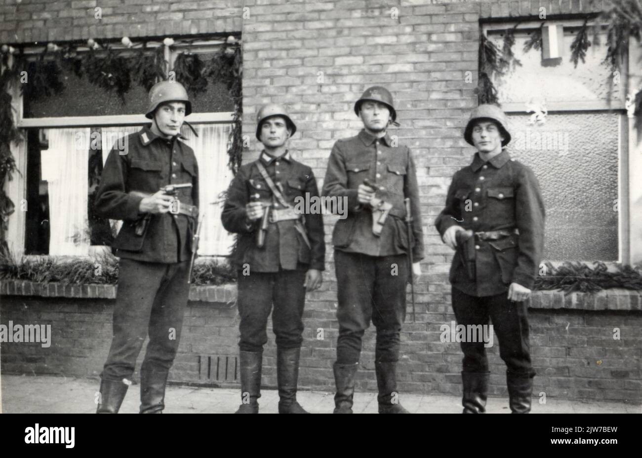 Image of four men dressed as German soldiers, participants in the ...