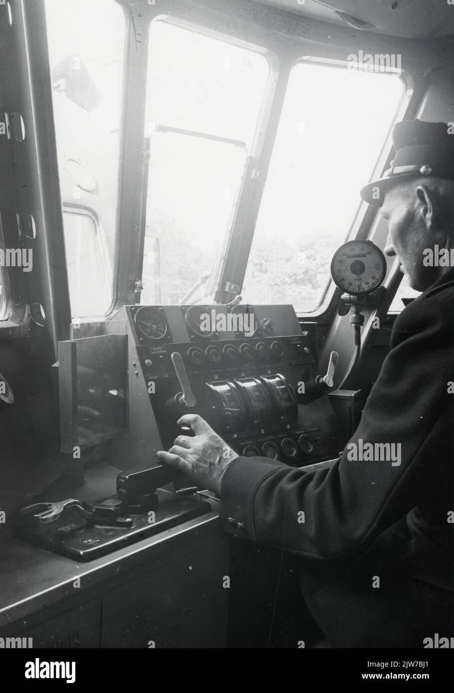 Image of a driver in the steering position of an electric train set ...