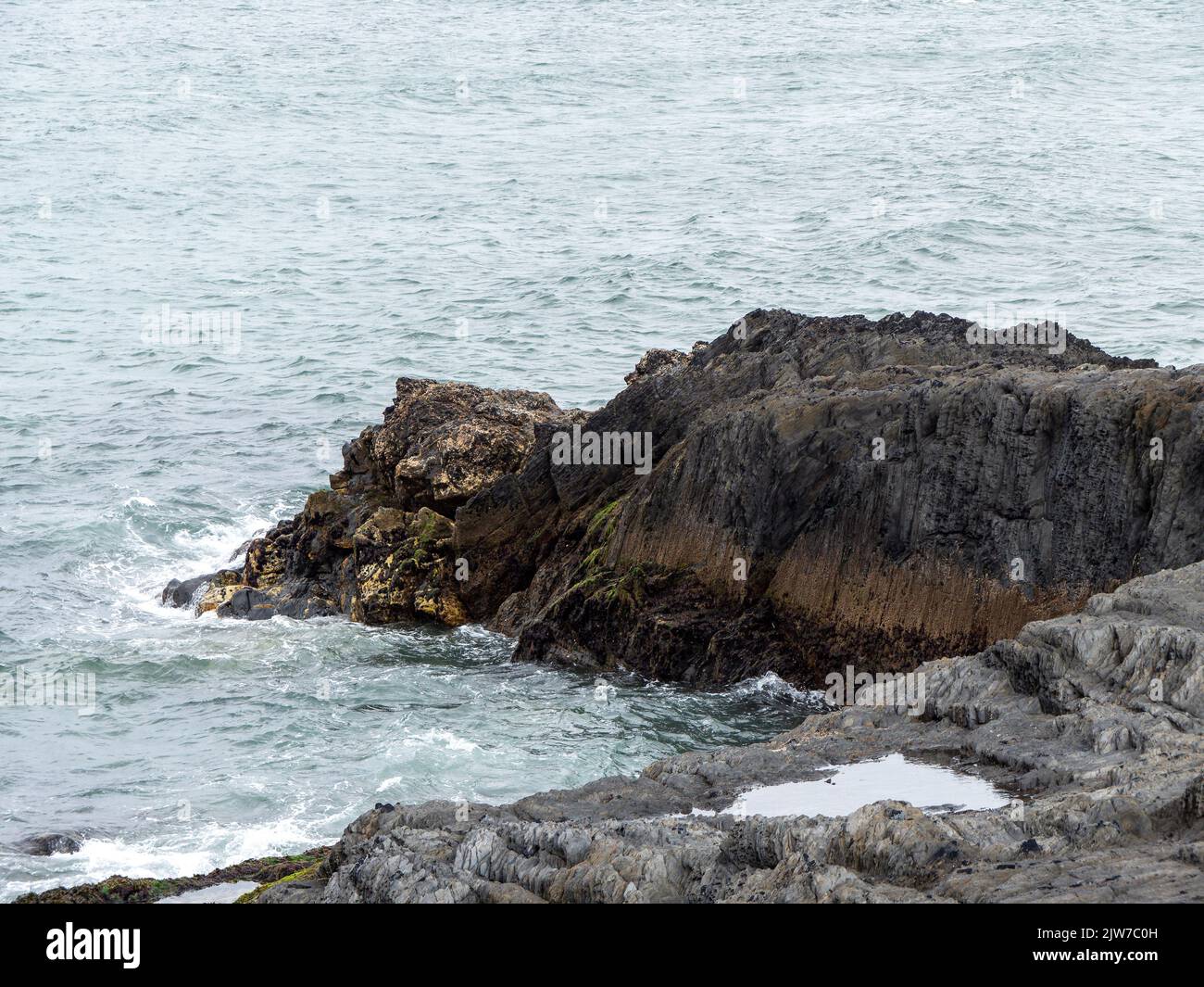 Wild rocks and sea water, landscape, rock formation beside body of ...