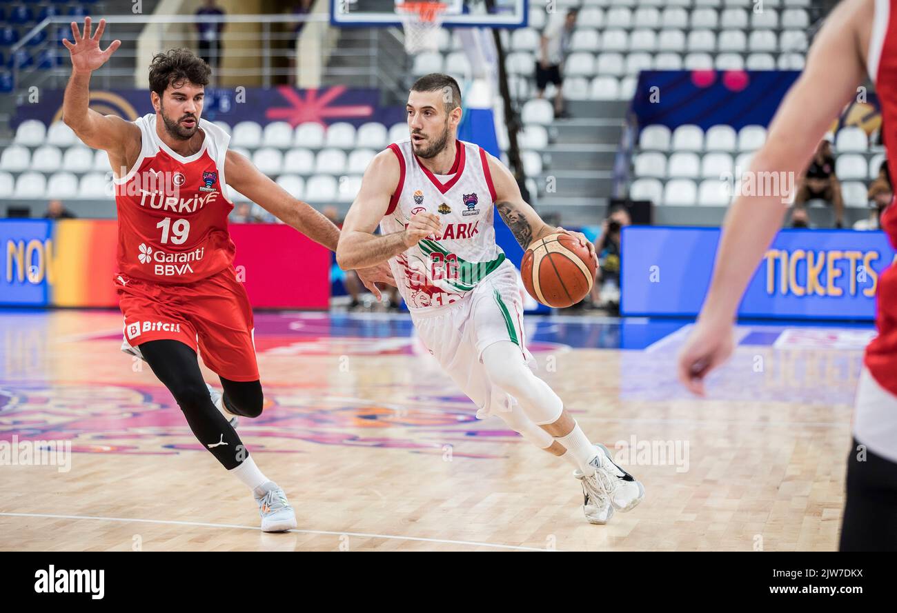 Pavlin Ivanov of Bulgaria drives to the basket followed by Bugrahan ...