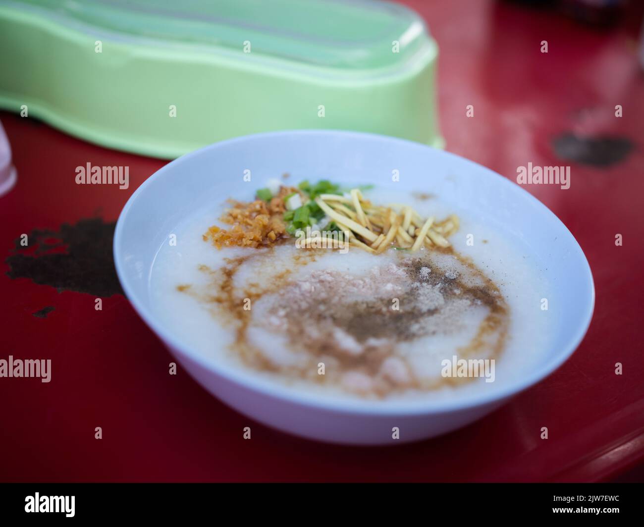 Chinese porridge with egg in a bowel with chinese donughnut . Concept ...