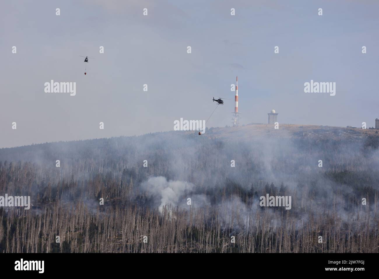 Schierke, Germany. 04th Sep, 2022. Firefighting helicopters are used to ...