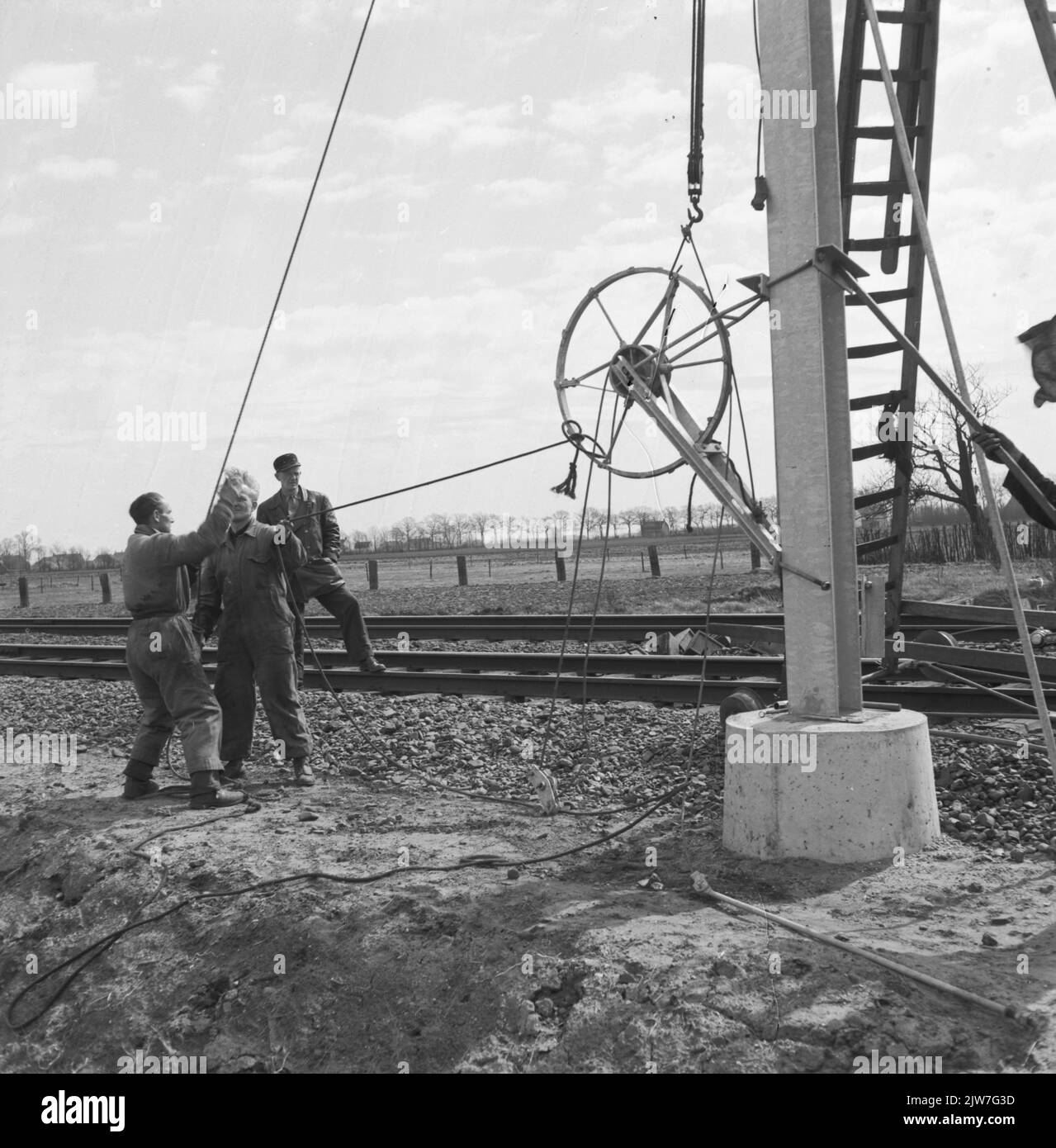 Image of placing a bullet at an overhead pipe portal in Wouw, during ...