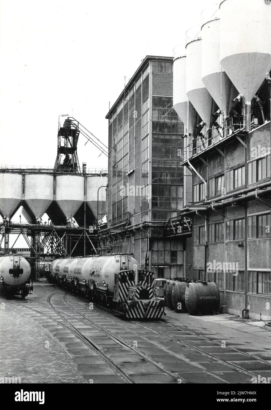 View of the rail connection with factory locomotive and freight wagons ...