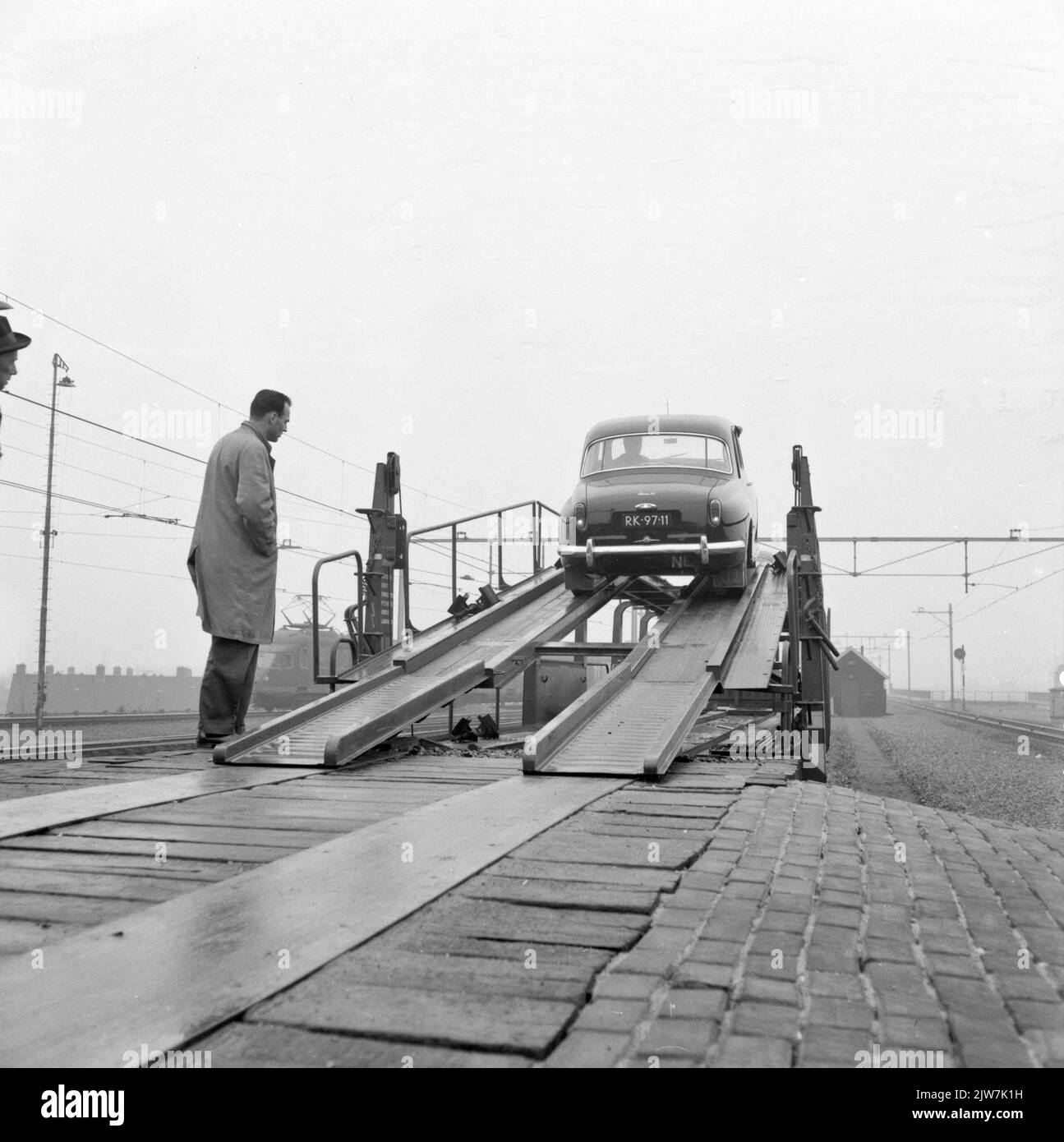 Image of parking a car on a double-cover car of a car sleeping train on ...