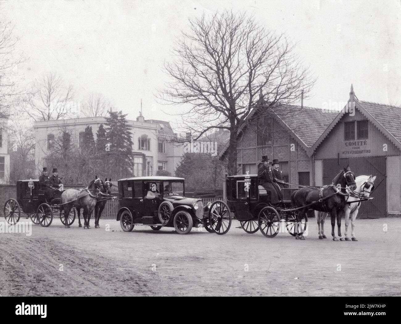 Image of a freight train loaded with coal, drawn by a steam locomotive ...