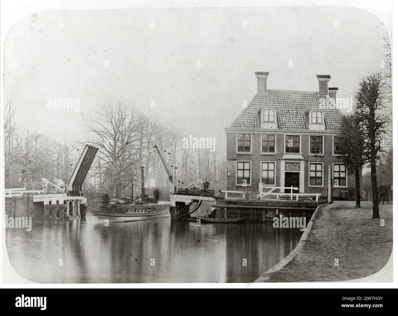 View of the Merwedekanaal with the opened Rijnhuizerbrug and a passing ...