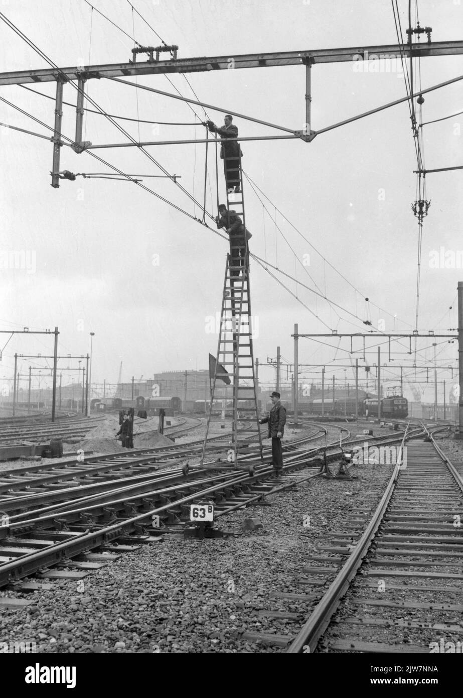 Image of work on the overhead line using a roll ladder on the ...