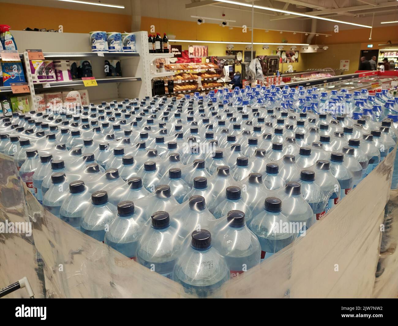 Drinking water in a Riga supermarket. Plastic bottles with drinking ...