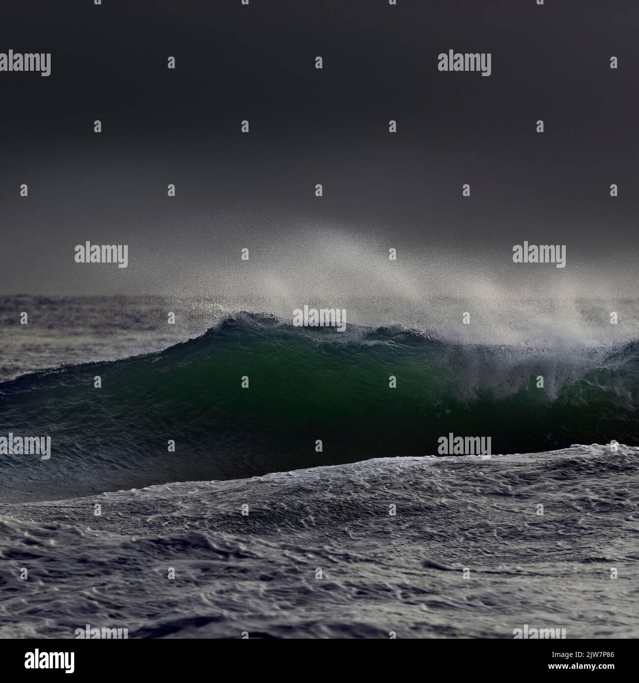 Moody waves crashing into shore at Praa sands beach Cornwall Stock Photo - Alamy