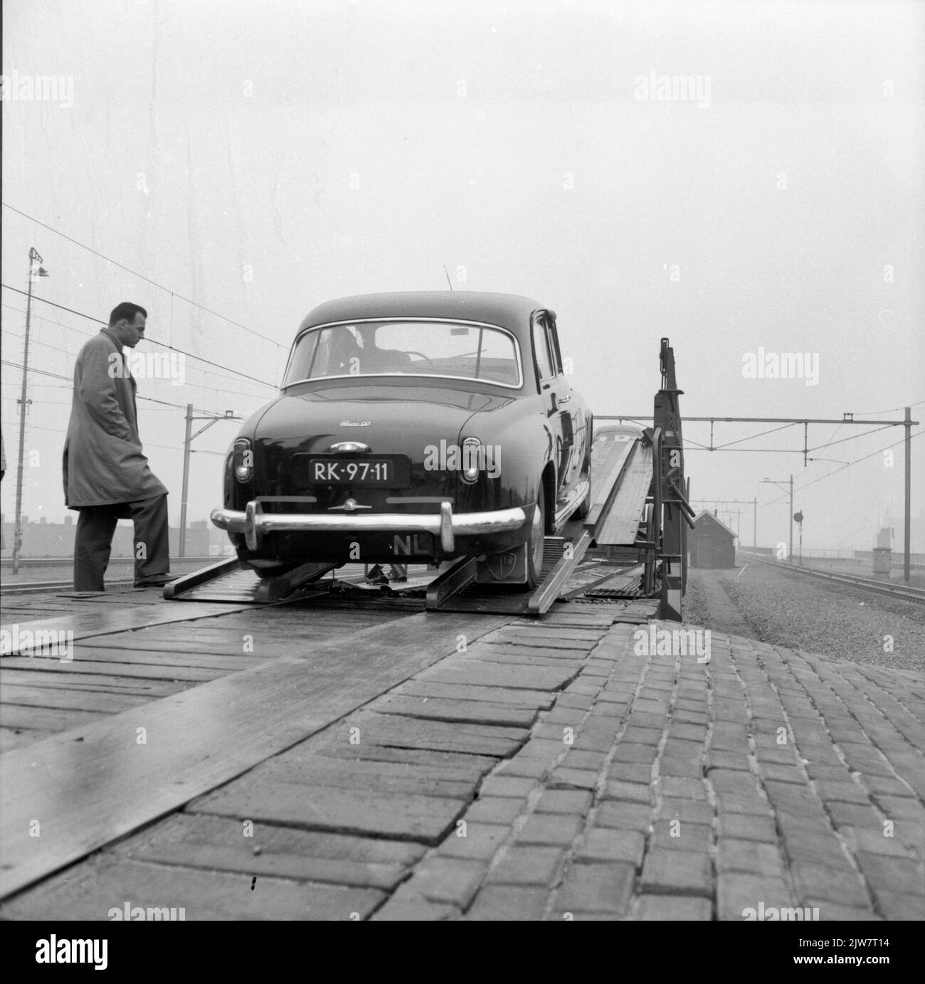 Image of parking a car on a double-cover car of a car sleeping train on ...