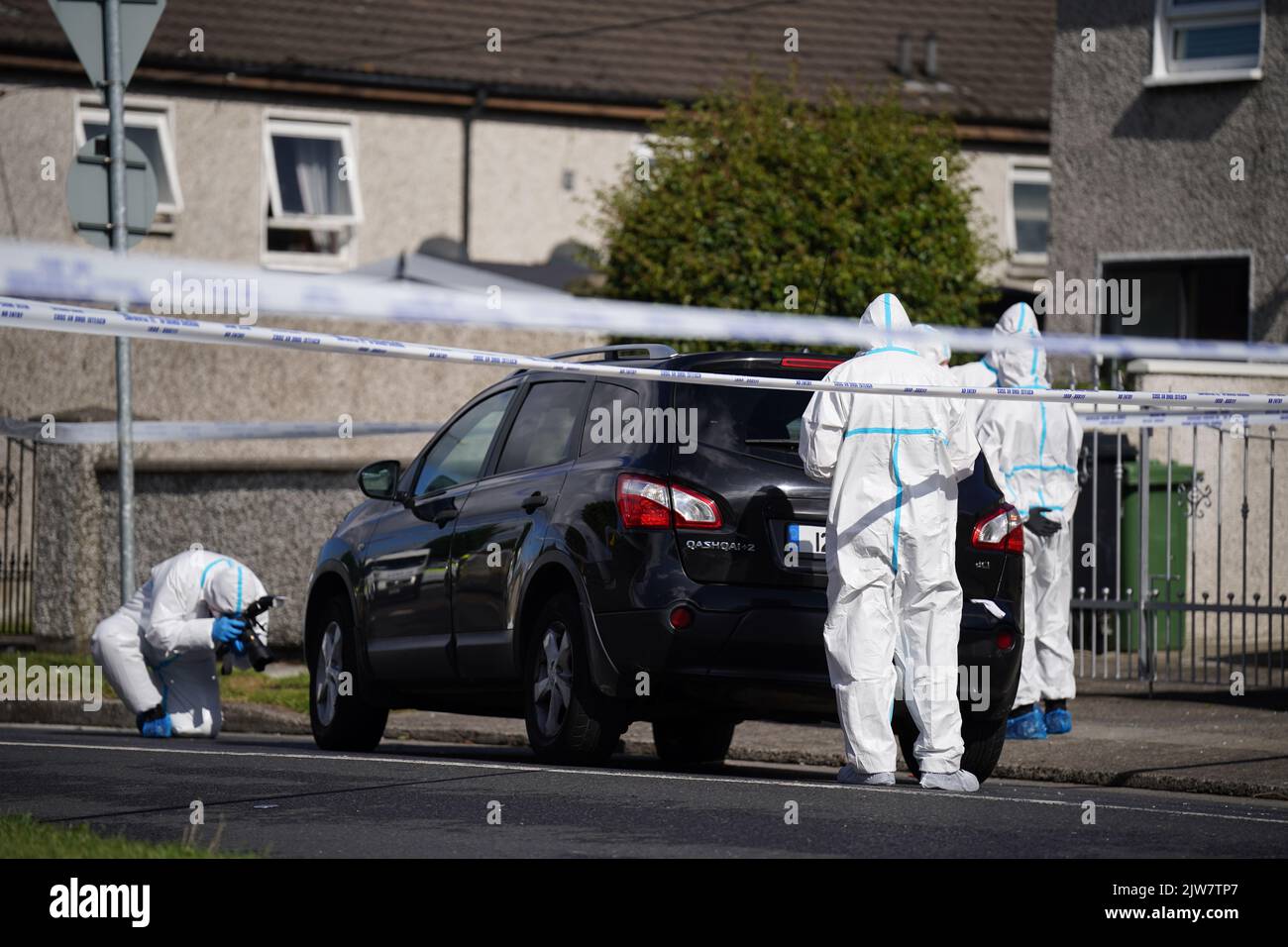 Forensic officers at the scene in the Rossfield Estate in Tallaght ...