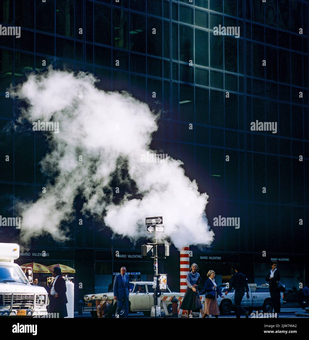 New York, 1980s, back-lit vapour raising out from steam pipe vent ...