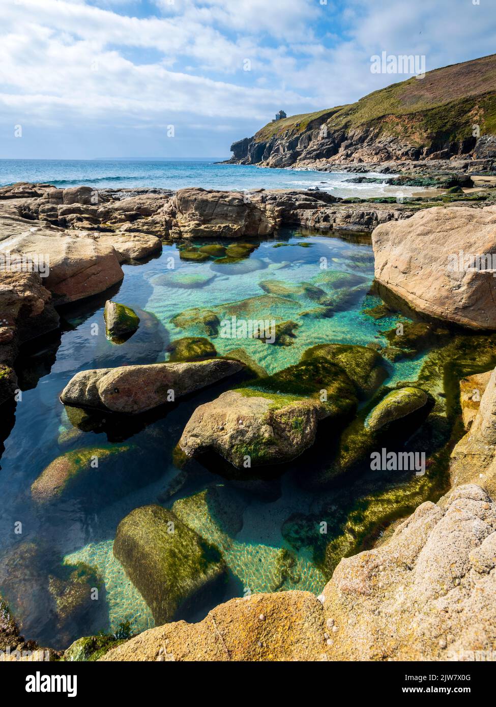 The amazing rock pools at Rinsey beach. Clear aqua tropical water pools ...