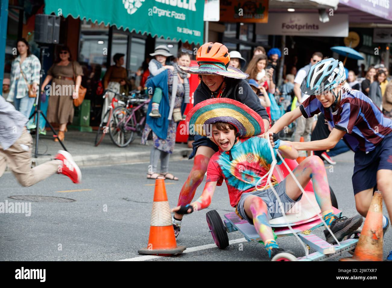 Children and adults take part in races with their bicycles, scooters ...