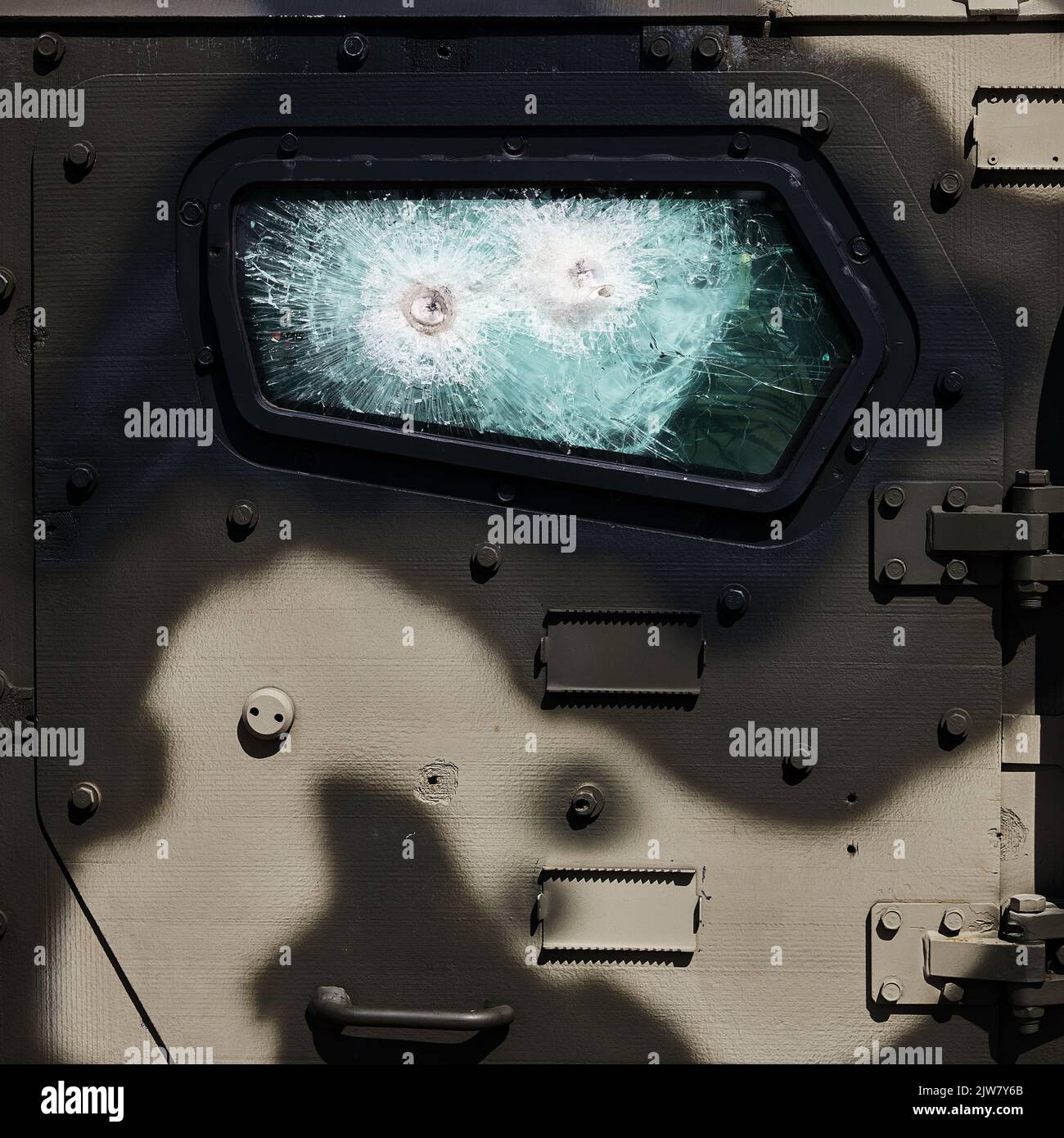 Armored car after the shelling. Bulletproof glass. Armored glass after ...