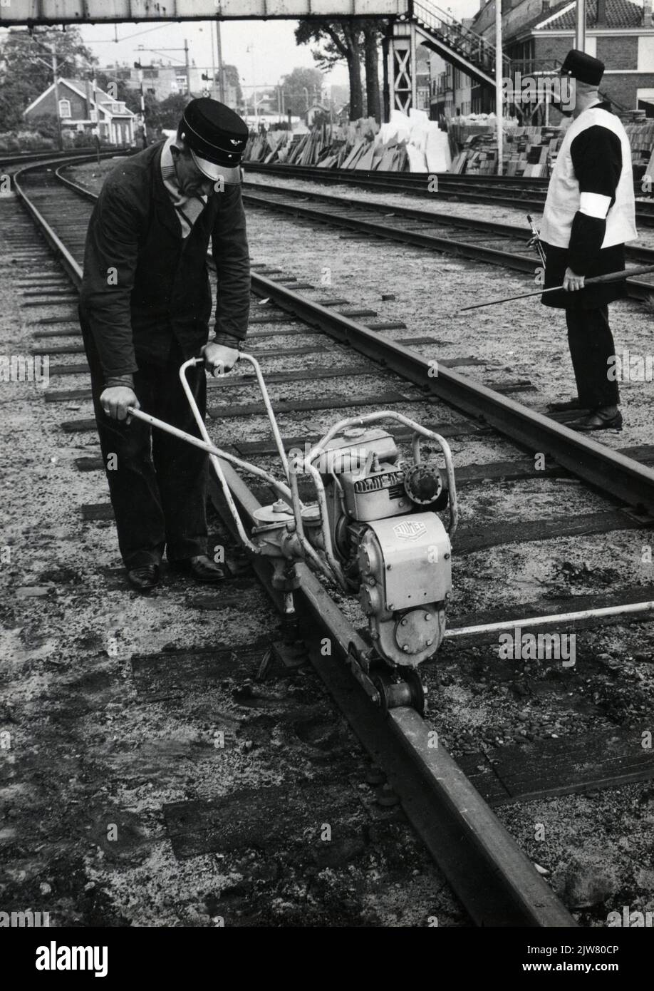 Image of a road worker from the N.S. During work on the railway line at ...