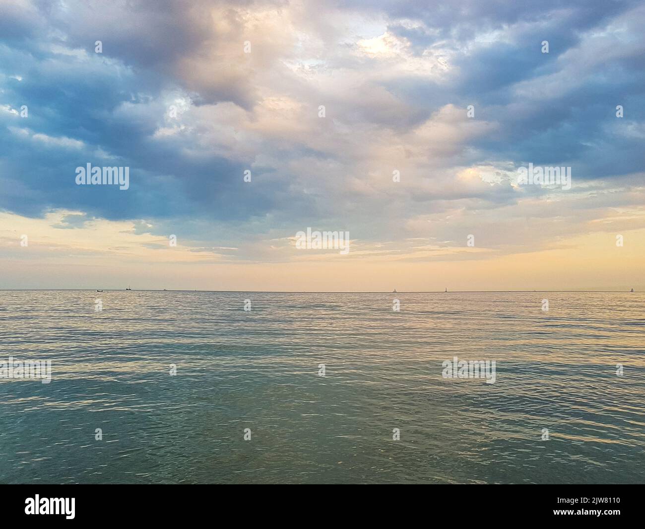 Seascape Sea with calm water and white clouds background Stock Photo ...
