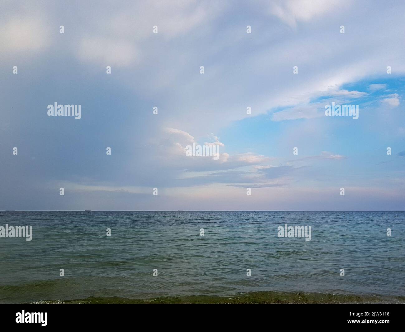 Seascape Sea with calm water and white clouds background Stock Photo ...