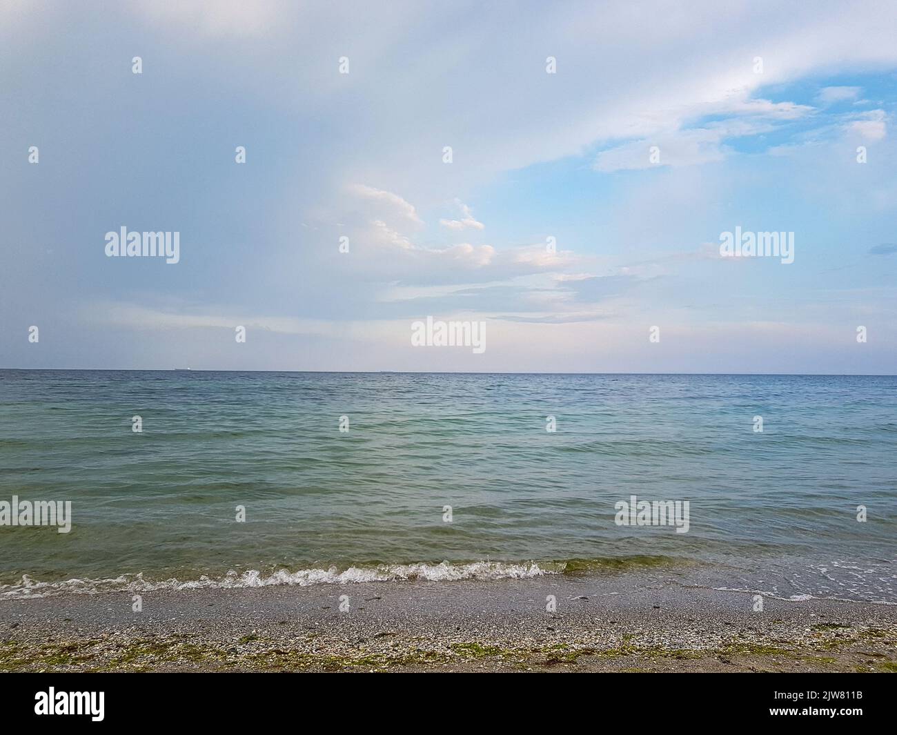 Seascape Sea with calm water and white clouds background Stock Photo ...