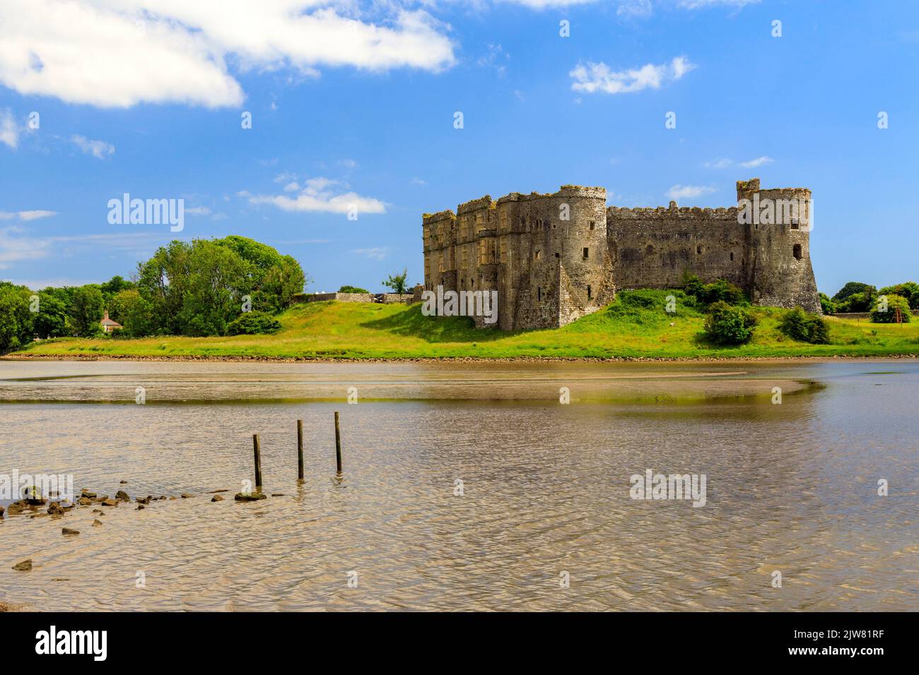 The 13th century Carew Castle ruins on the banks of the Carew River ...