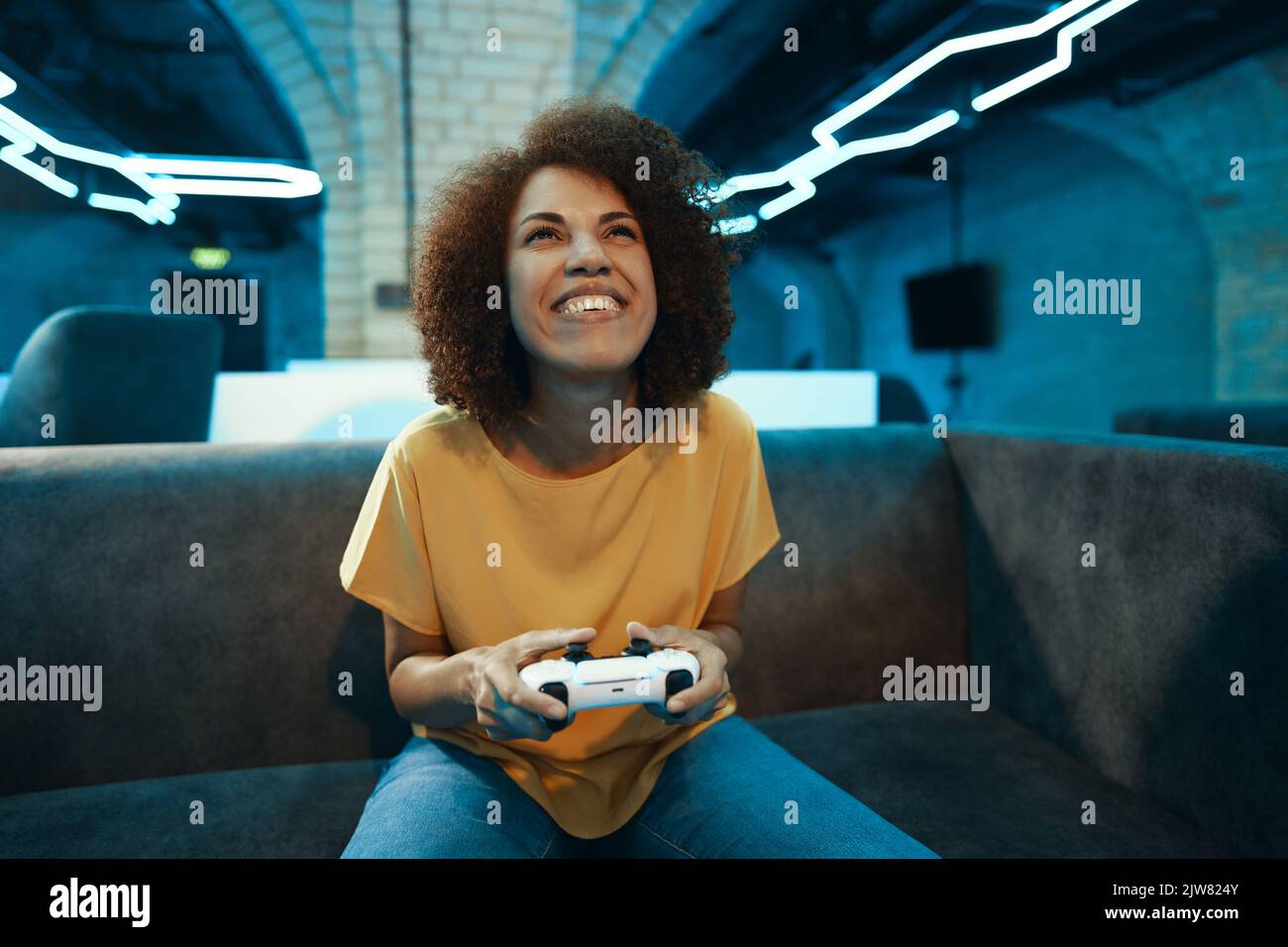 Woman play game on console hi-res stock photography and images - Alamy