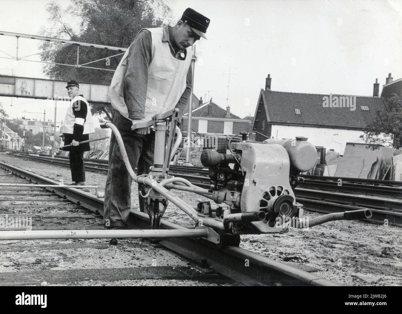 Image of a road worker from the N.S. With a crossbar drilling machine ...