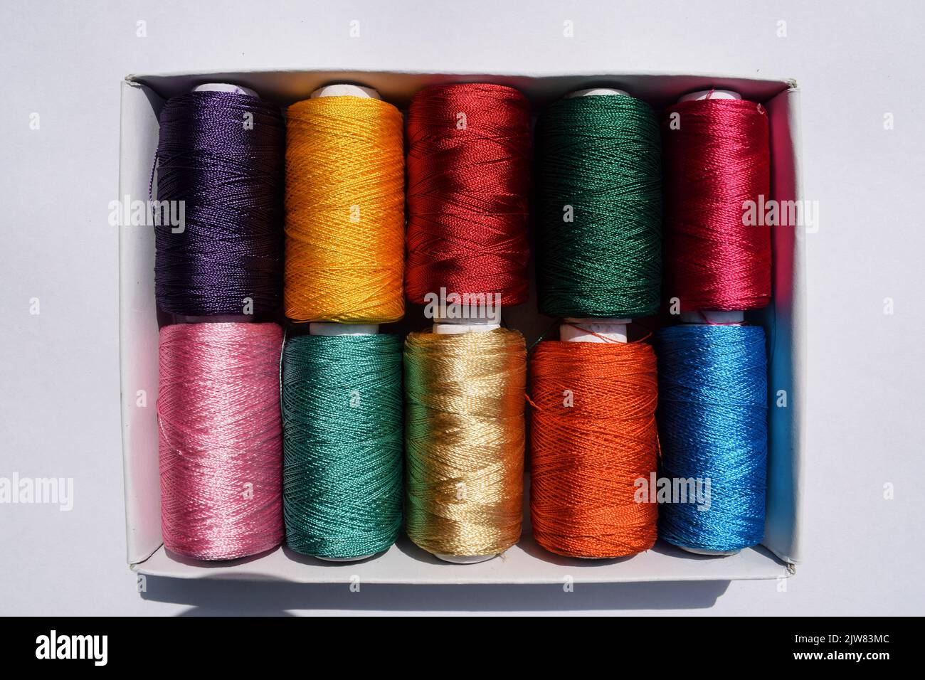 Top view of Multi color Silk thread spools. Silk threads of many ...