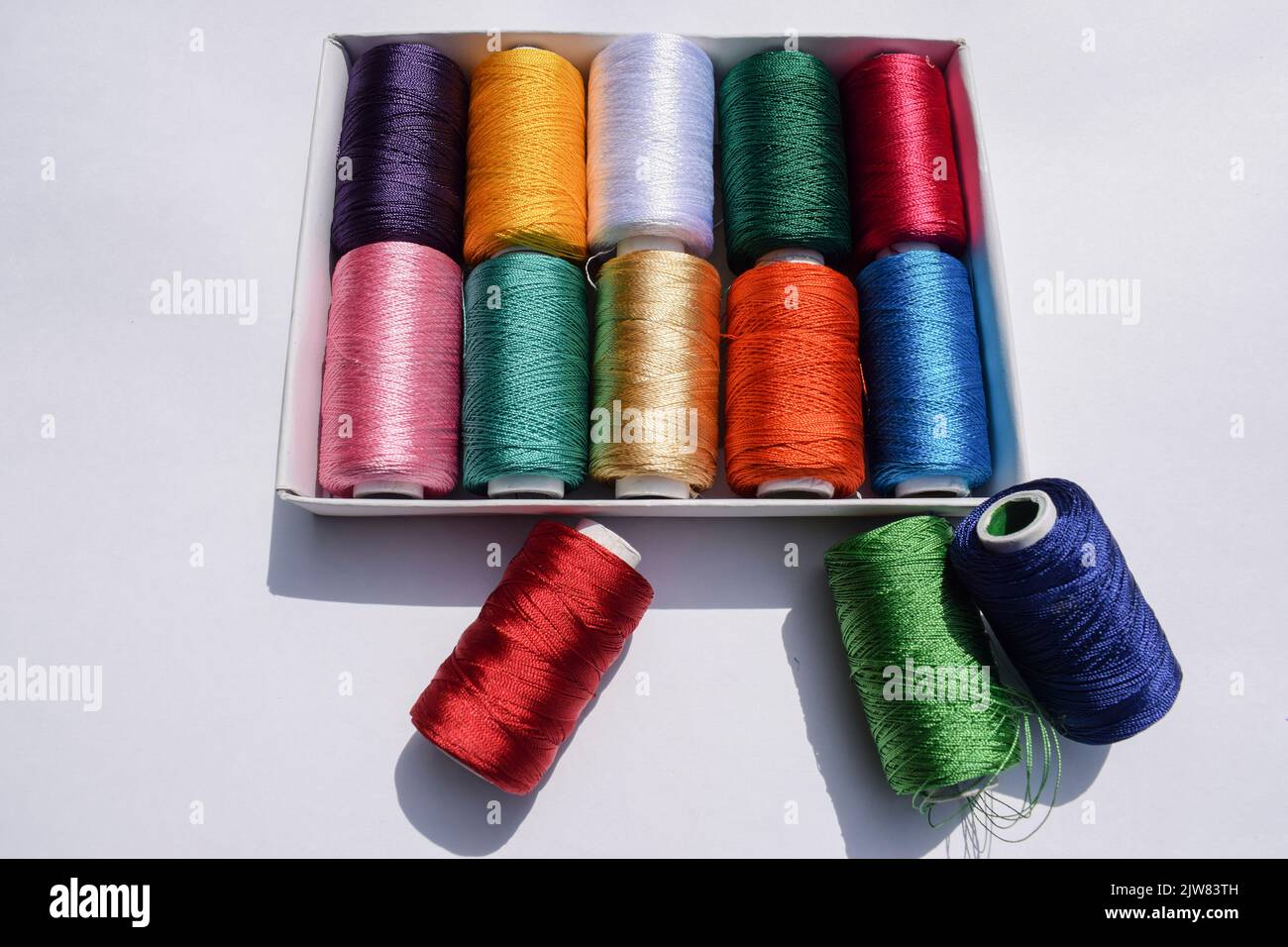 Top view of Multi color Silk thread spools. Silk threads of many ...
