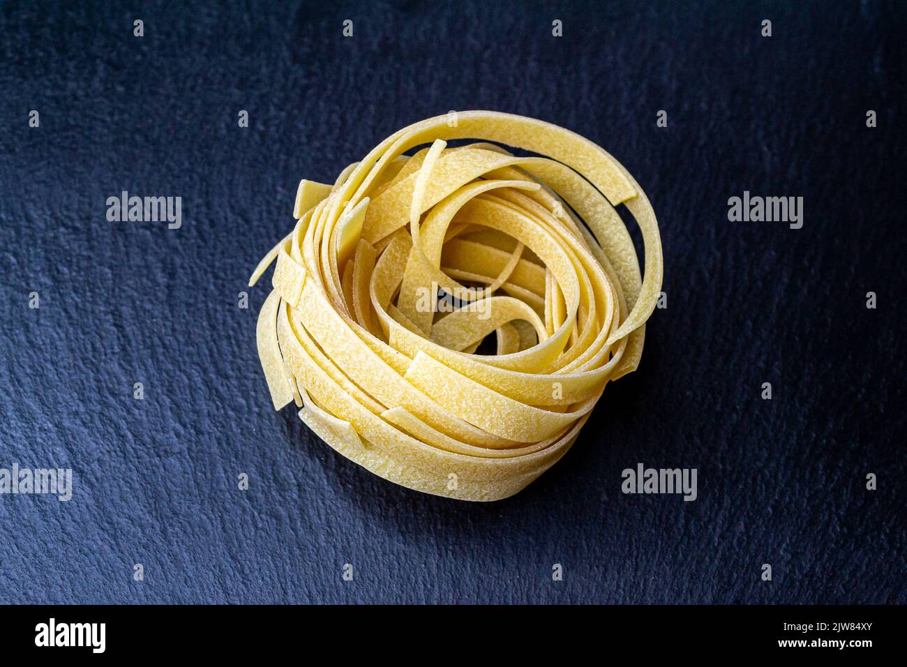 Dry Italian tagliatelle pasta background healthy food photo Top view ...
