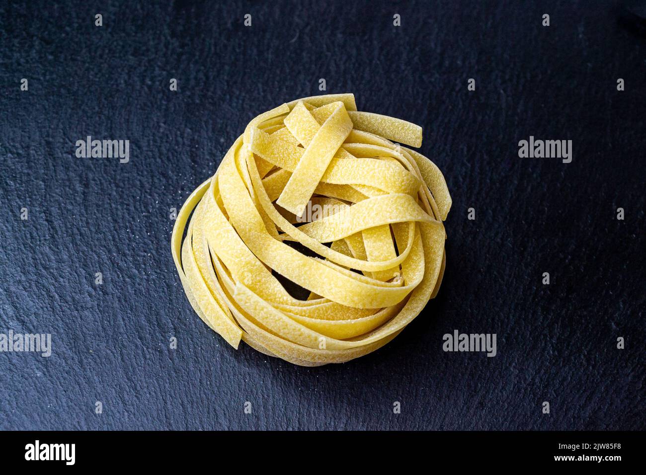 Dry Italian tagliatelle pasta background healthy food photo Top view ...