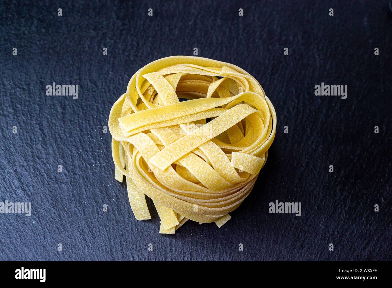 Dry Italian tagliatelle pasta background healthy food photo Top view ...